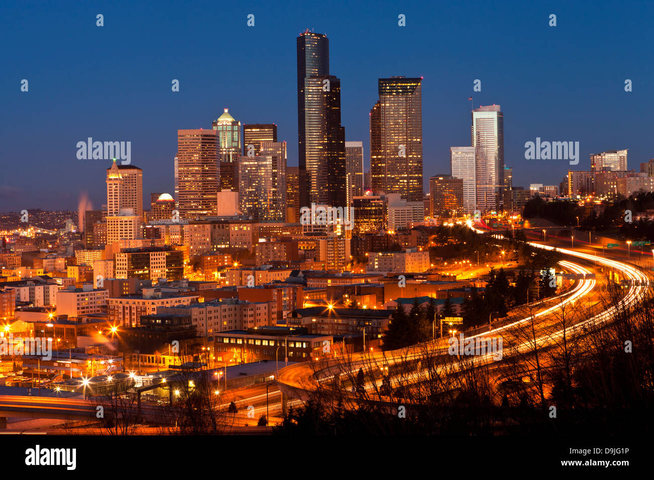 Seattle cityscape at night with the Columbia Tower and freeway, as seen ...