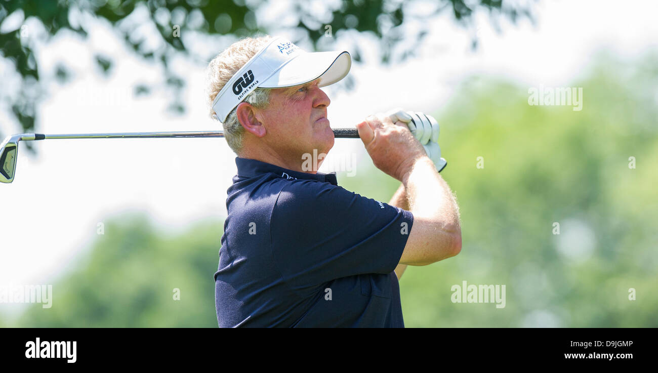 Scottish golf player Colin Montgomerie hits the ball at the BMW Open ...
