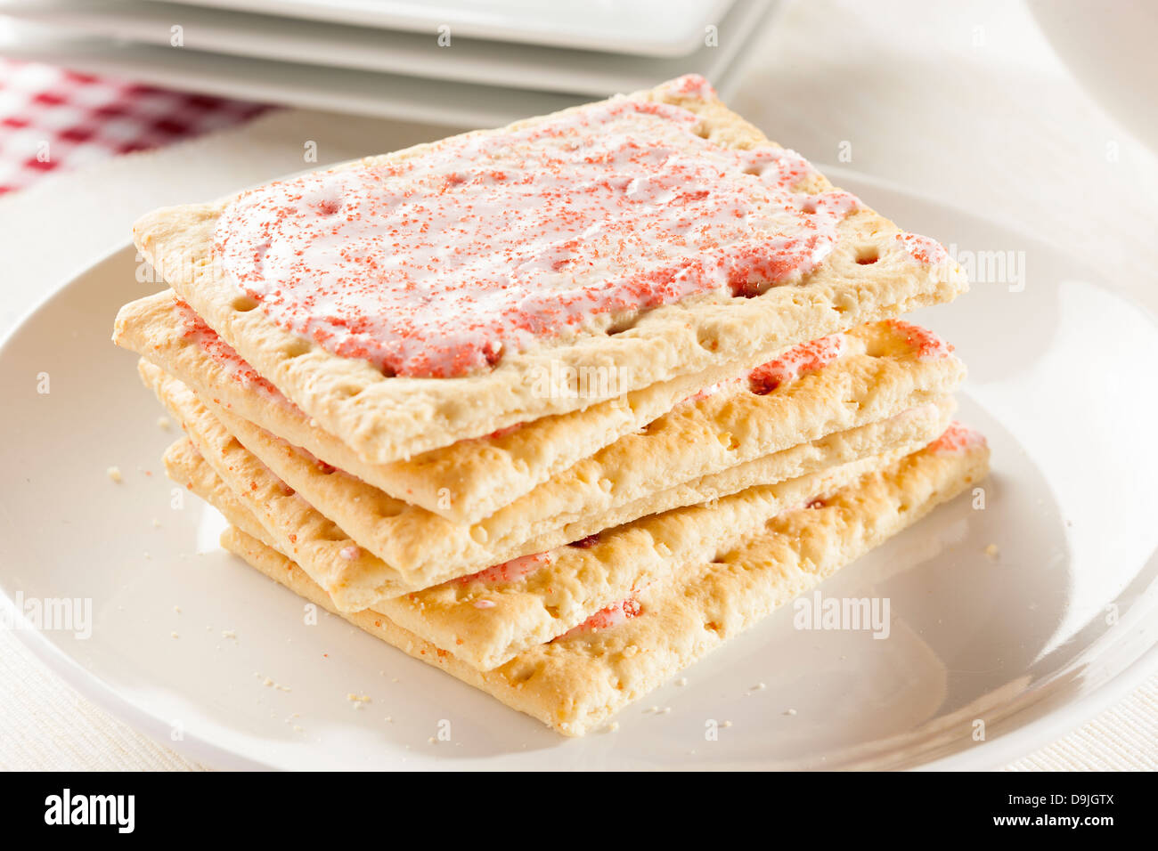 Hot Strawberry Toaster Pastry with frosting and sprinkles Stock Photo ...