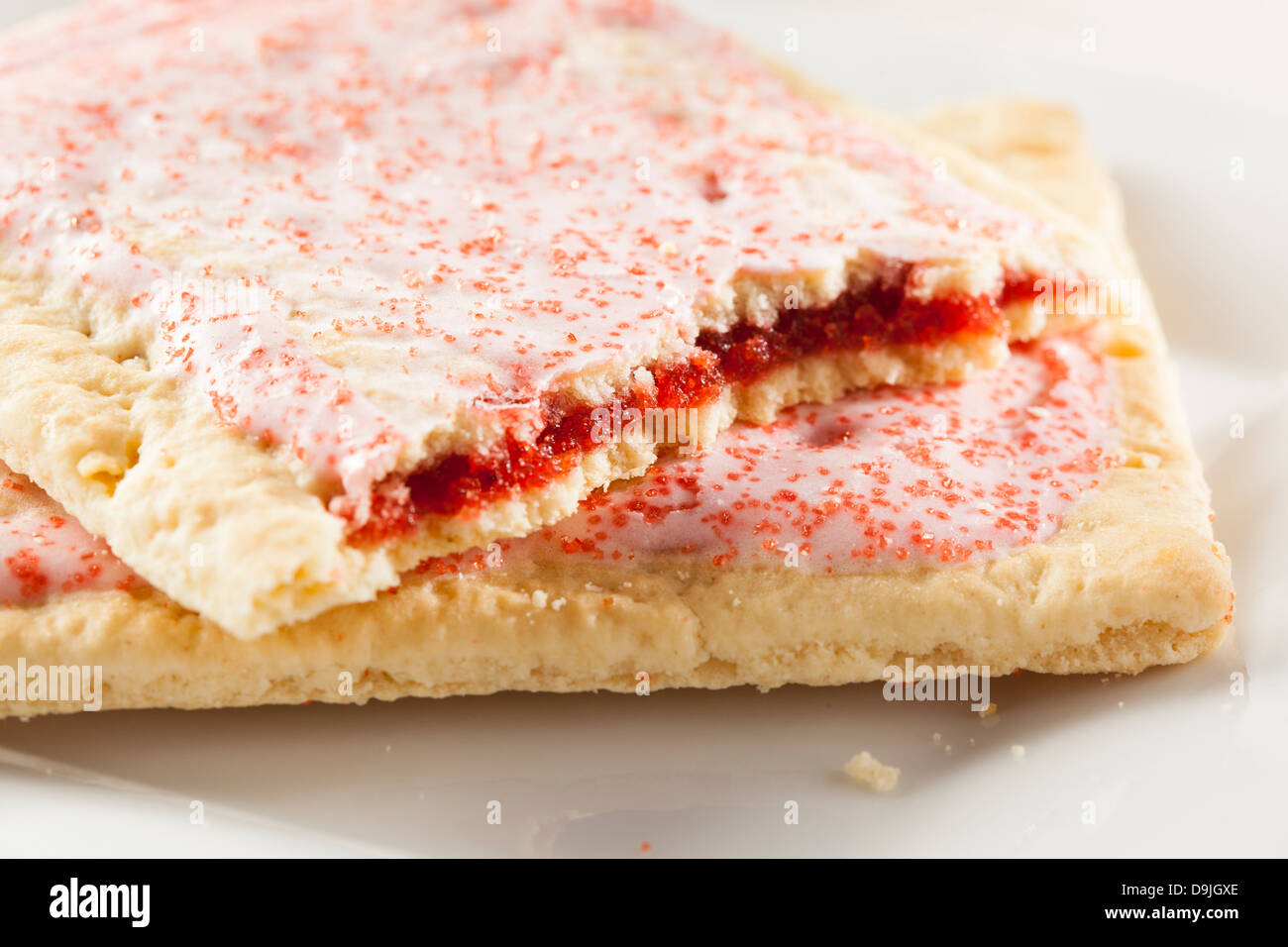 Hot Strawberry Toaster Pastry with frosting and sprinkles Stock Photo ...
