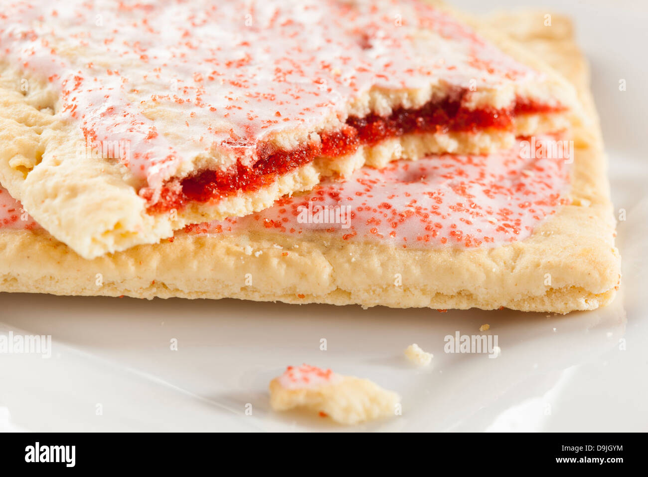 Hot Strawberry Toaster Pastry with frosting and sprinkles Stock Photo ...
