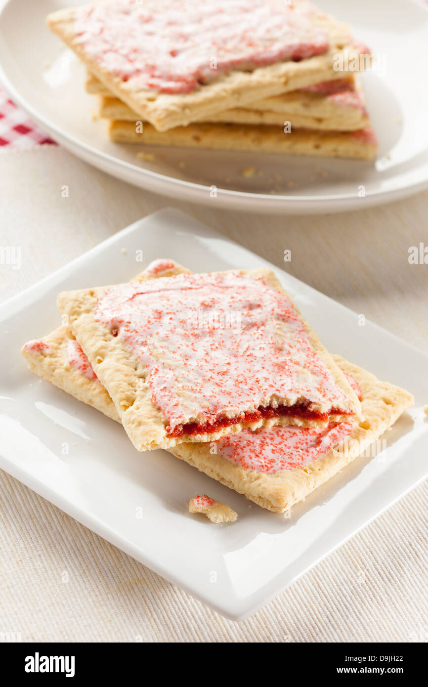 Hot Strawberry Toaster Pastry with frosting and sprinkles Stock Photo ...