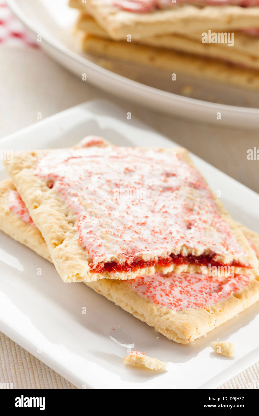 Hot Strawberry Toaster Pastry with frosting and sprinkles Stock Photo ...