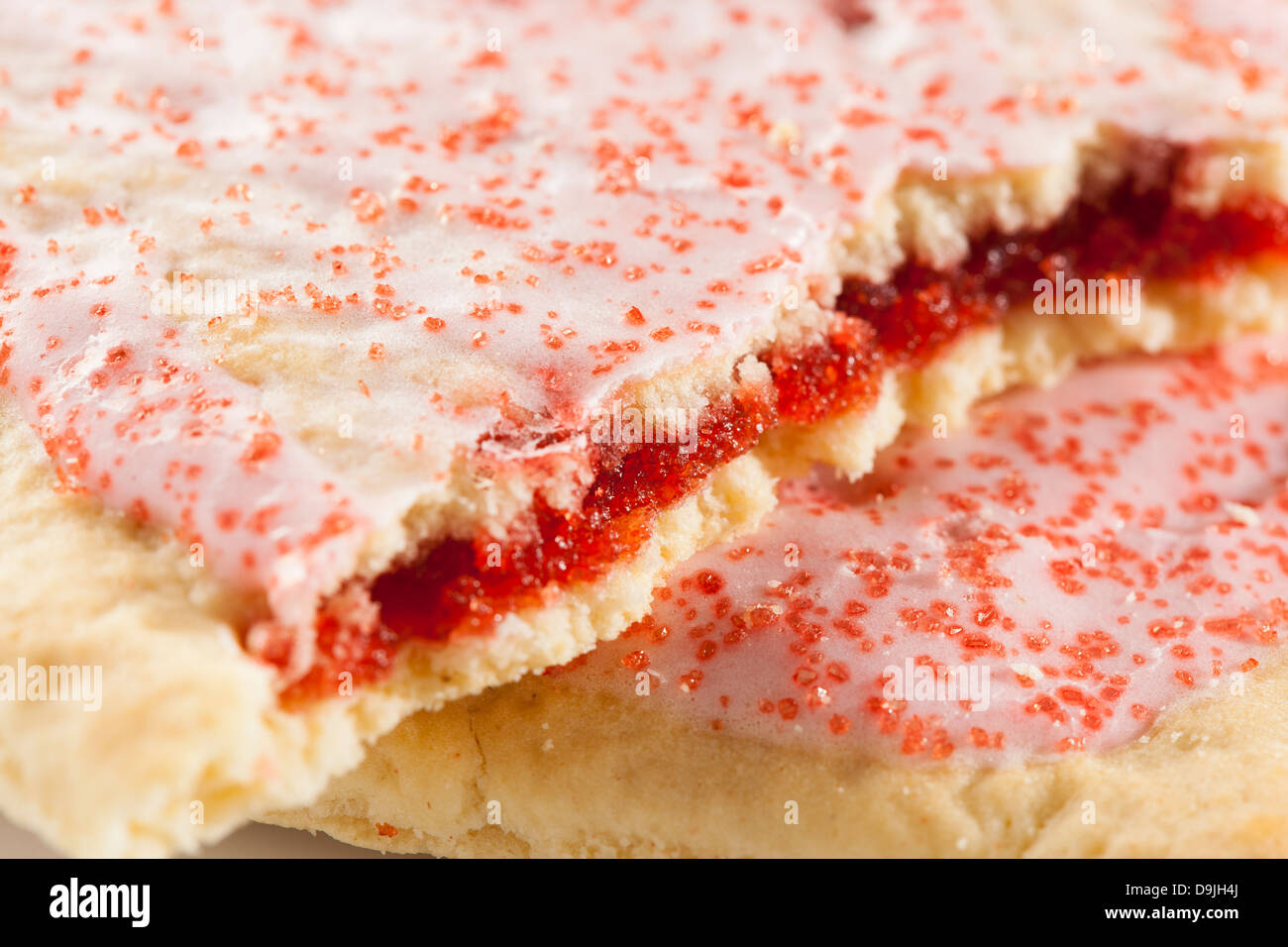 Hot Strawberry Toaster Pastry with frosting and sprinkles Stock Photo ...