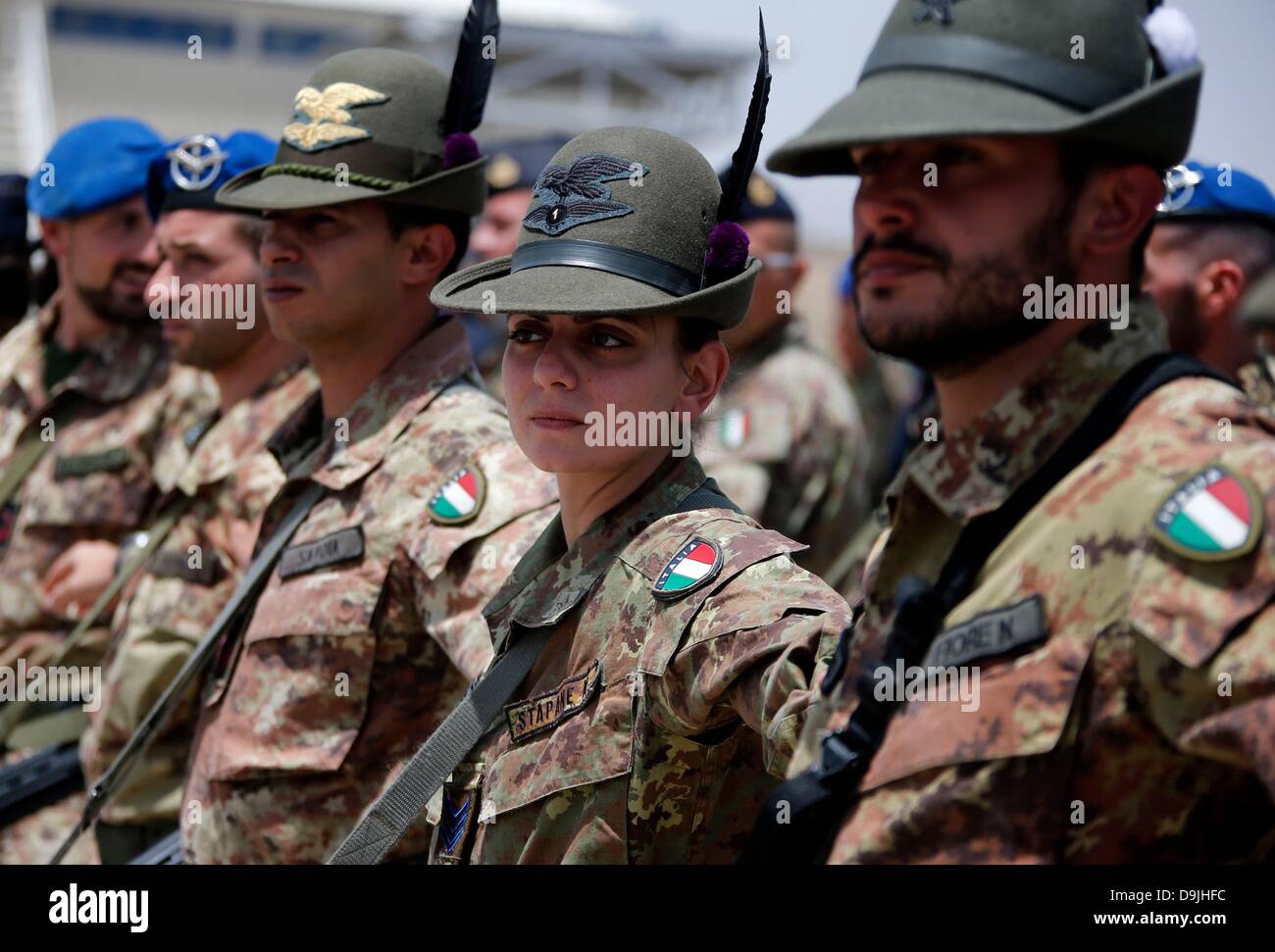 Italian armed force soldiers of the mountain unit Alpini stand in line ...