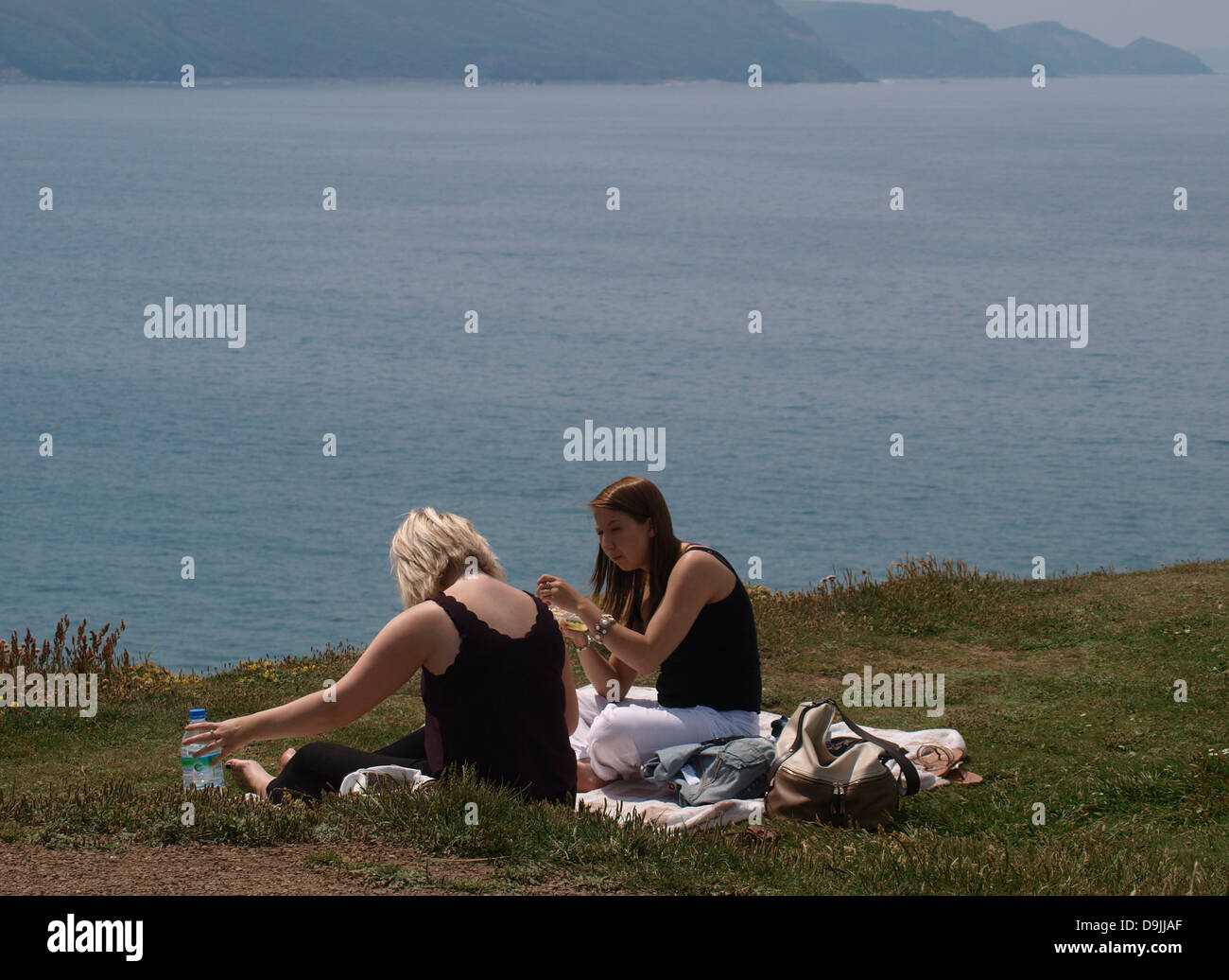 Cliff top picnic woman hi-res stock photography and images - Alamy