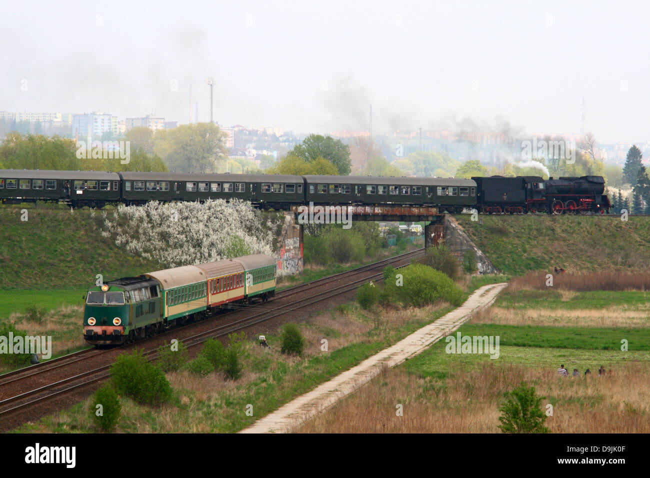 Two levels crossing of the steam and diesel hauled trains Stock Photo ...
