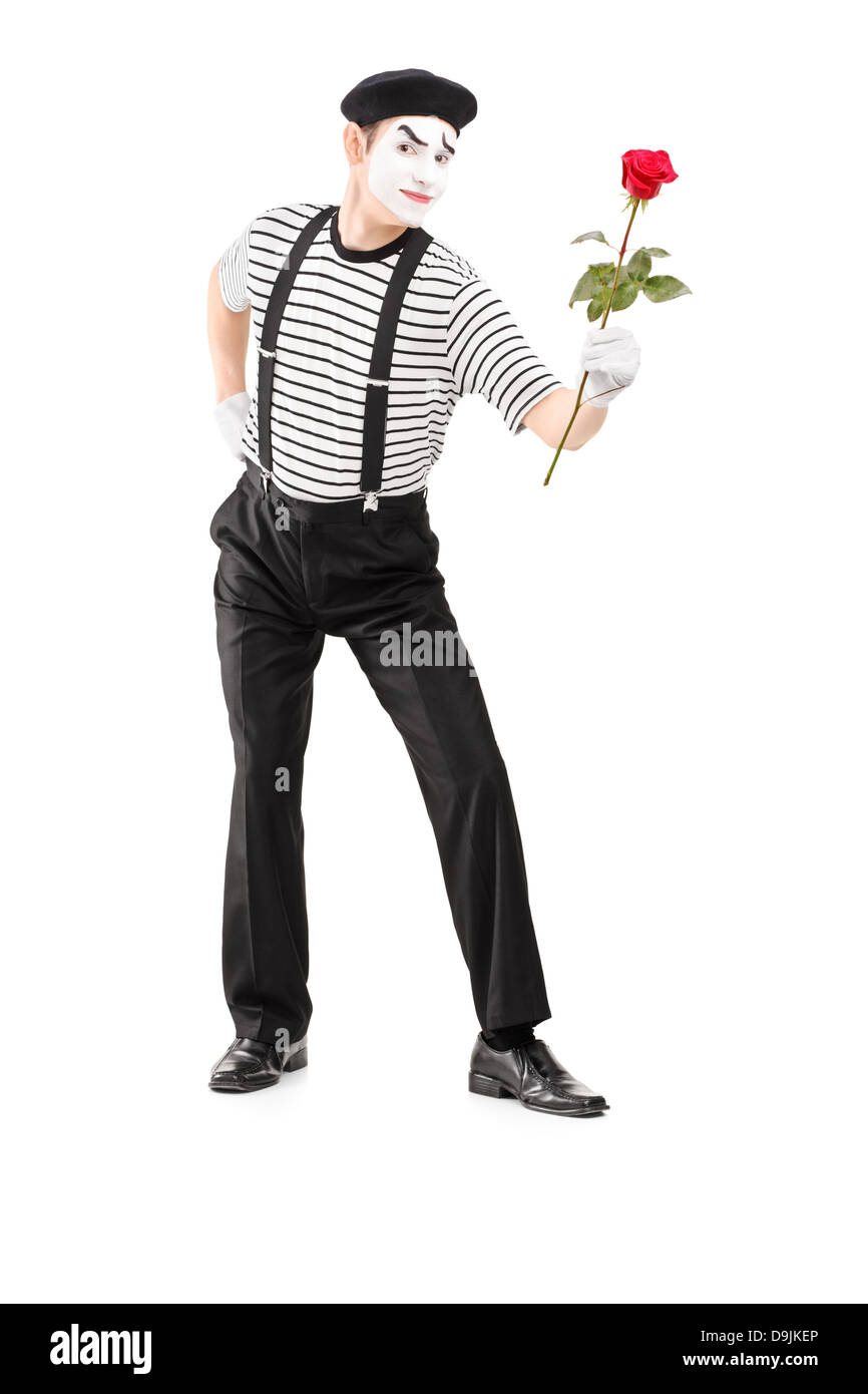 Full length portrait of a mime artist giving a rose flower Stock Photo ...