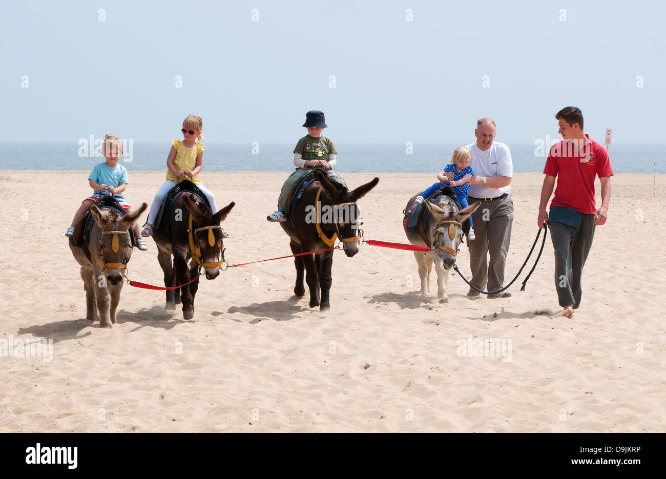 Children donkey seaside england hi-res stock photography and images - Alamy