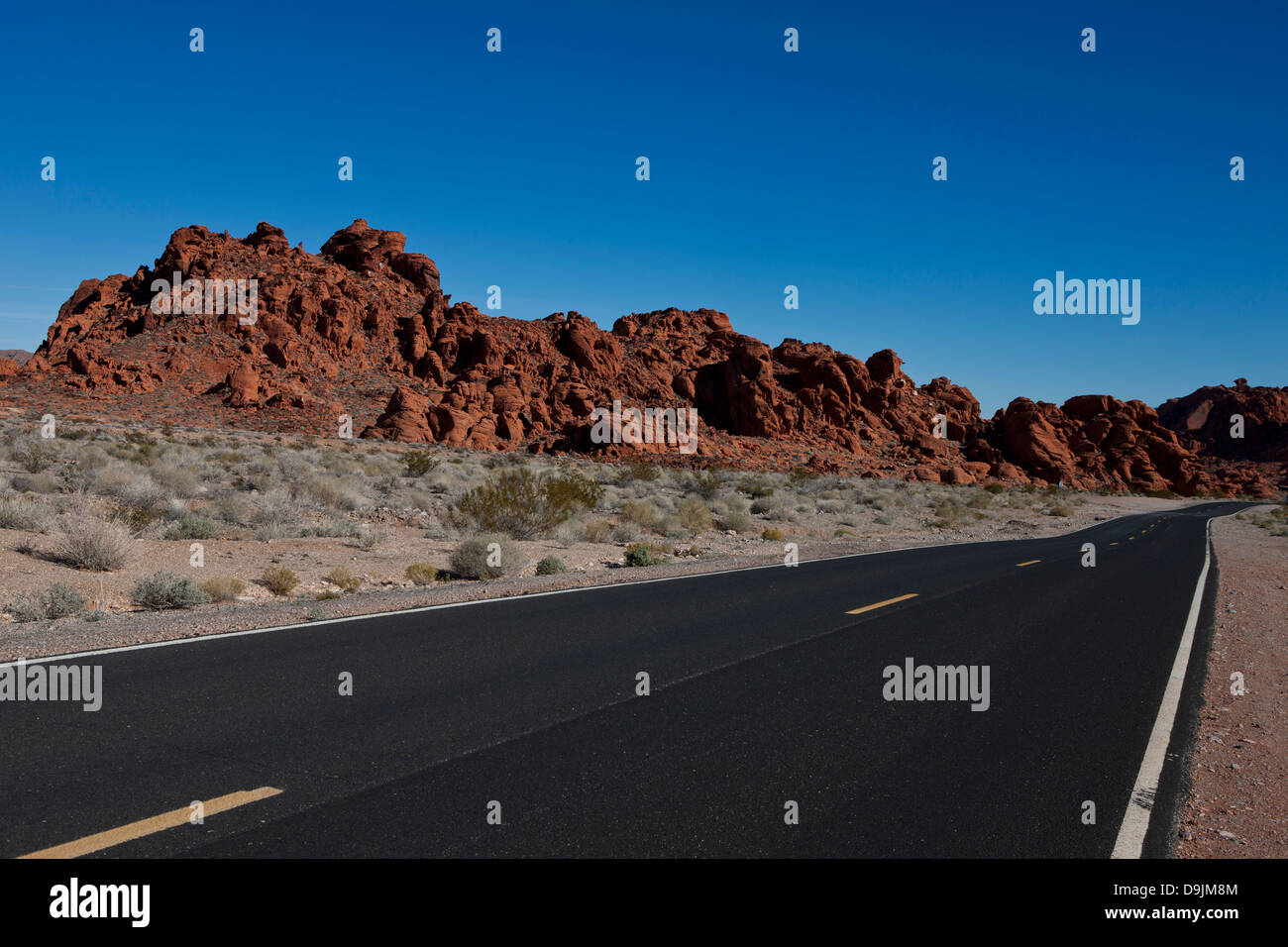 Valley of Fire Road with red sandstone formations in the background ...