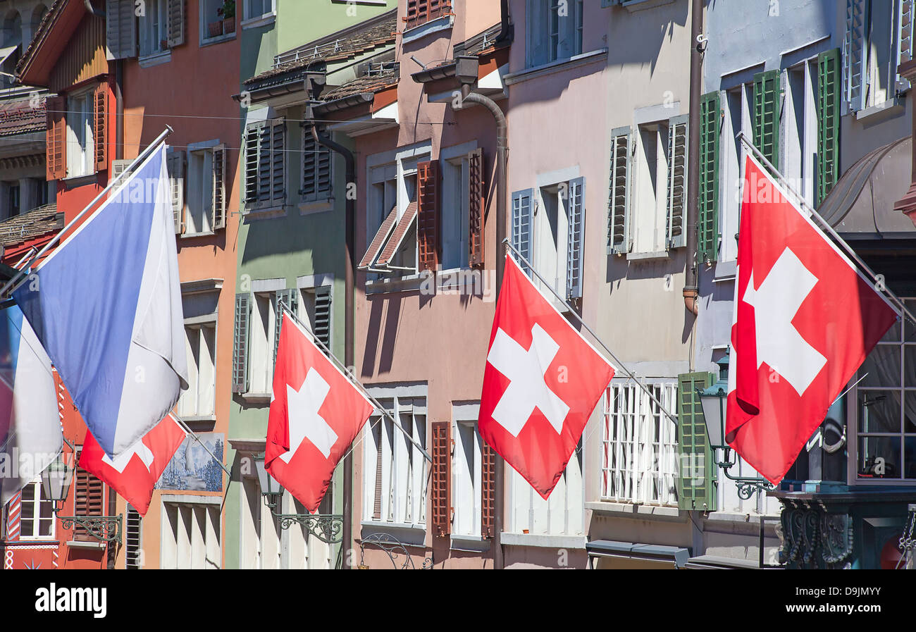 Ancient street Augustinergasse in Zurich decorated with swiss flags ...