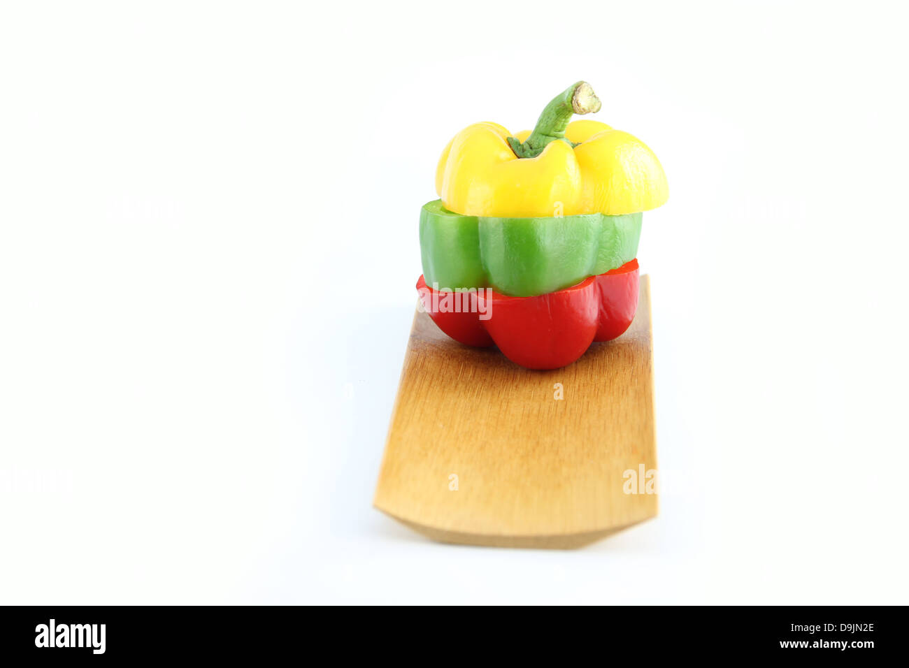 Three color of Sweet pepper Slice in the Bamboo dish on white ...