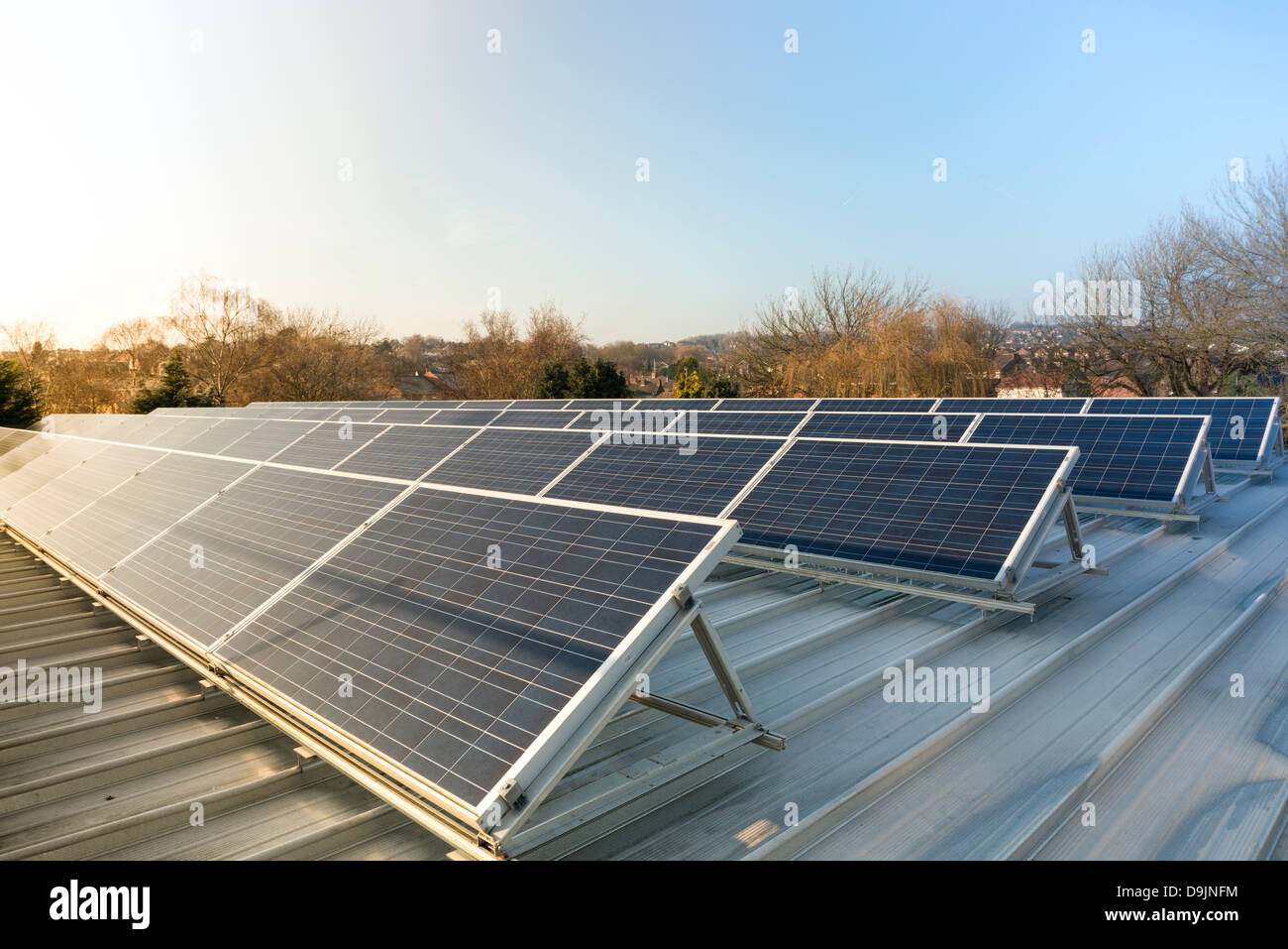 Photovoltaic solar panels on a factory roof Stock Photo - Alamy