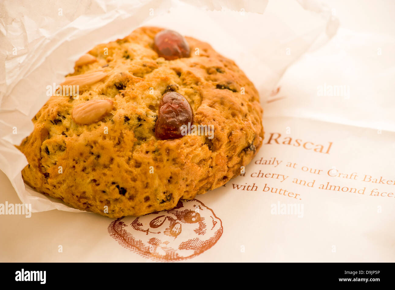 A Yorkshire Fat Rascal scone emerging from a paper bag from the famous ...