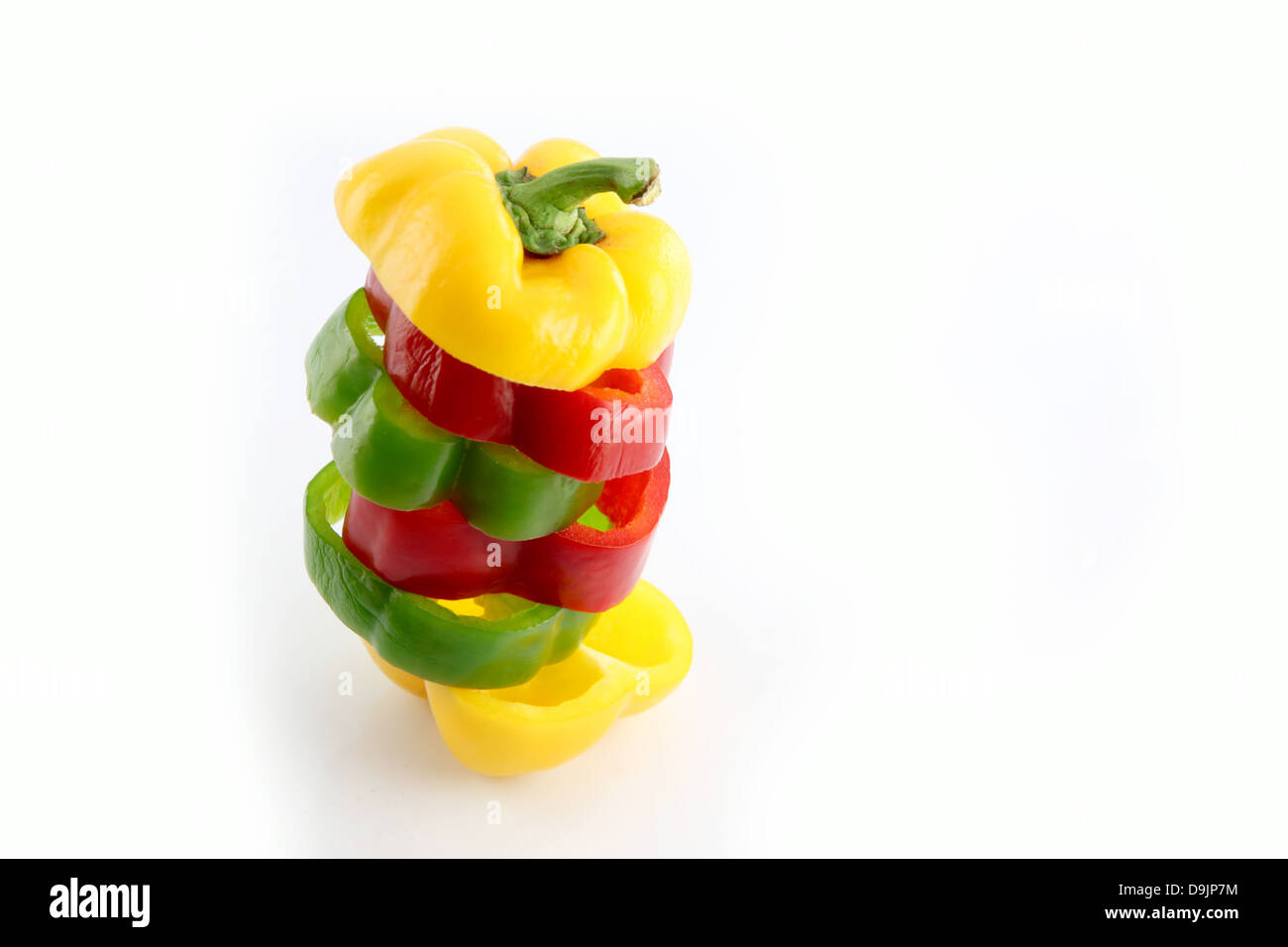 Slice the Three color of bell pepper in Arranged vertically on white ...