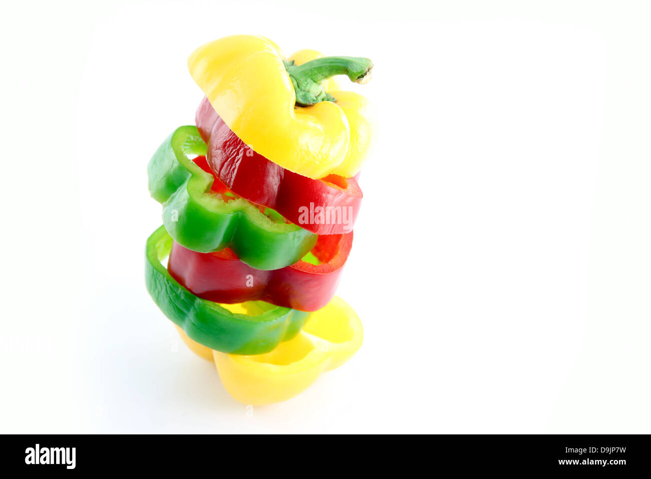 Slice the Three color of bell pepper in Arranged vertically on white ...