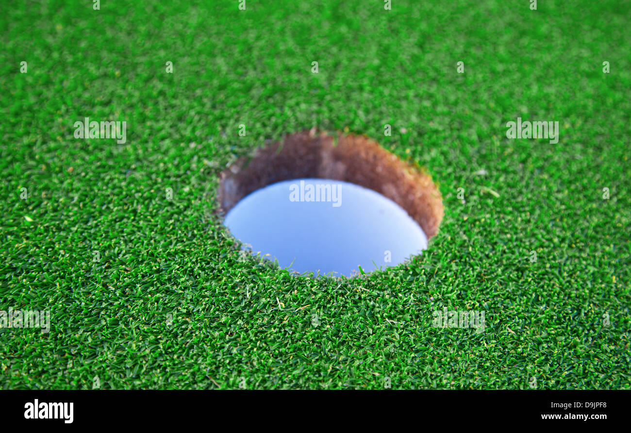 Golf hole on the green grass Stock Photo - Alamy