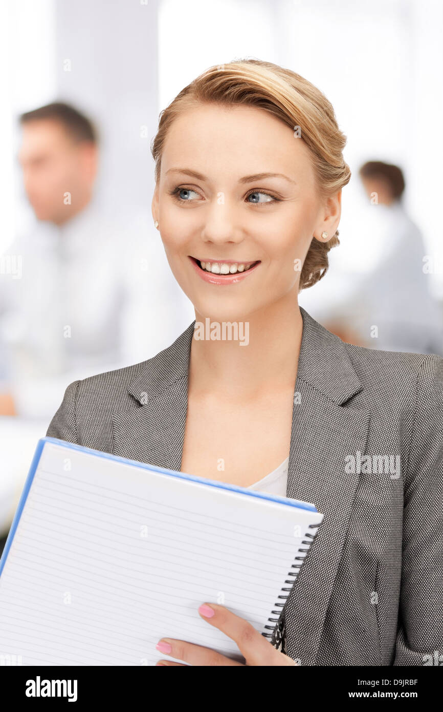 happy woman with big notepad Stock Photo - Alamy