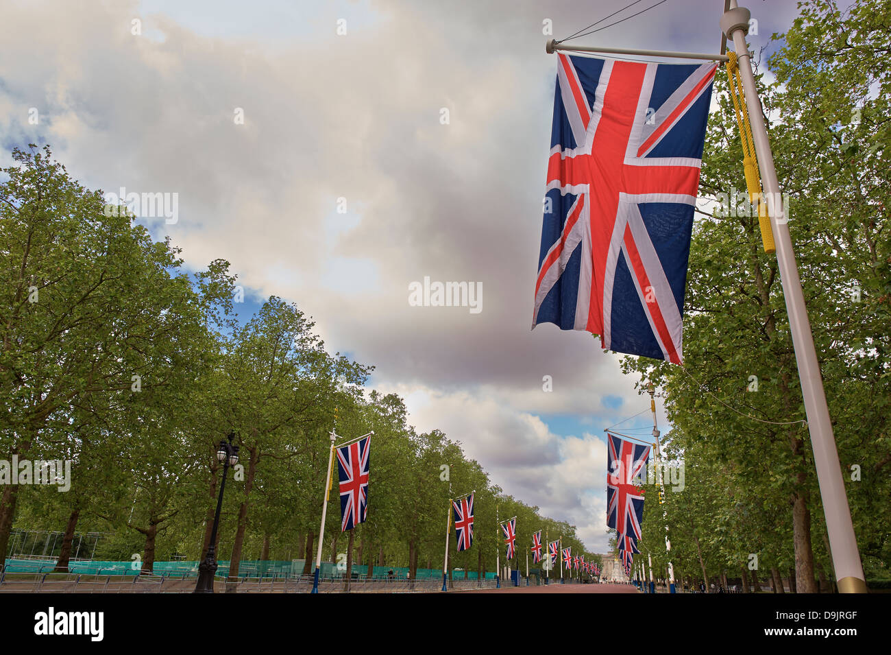 Flags flying in The Mall with Buckingham Palace in the distance Stock ...