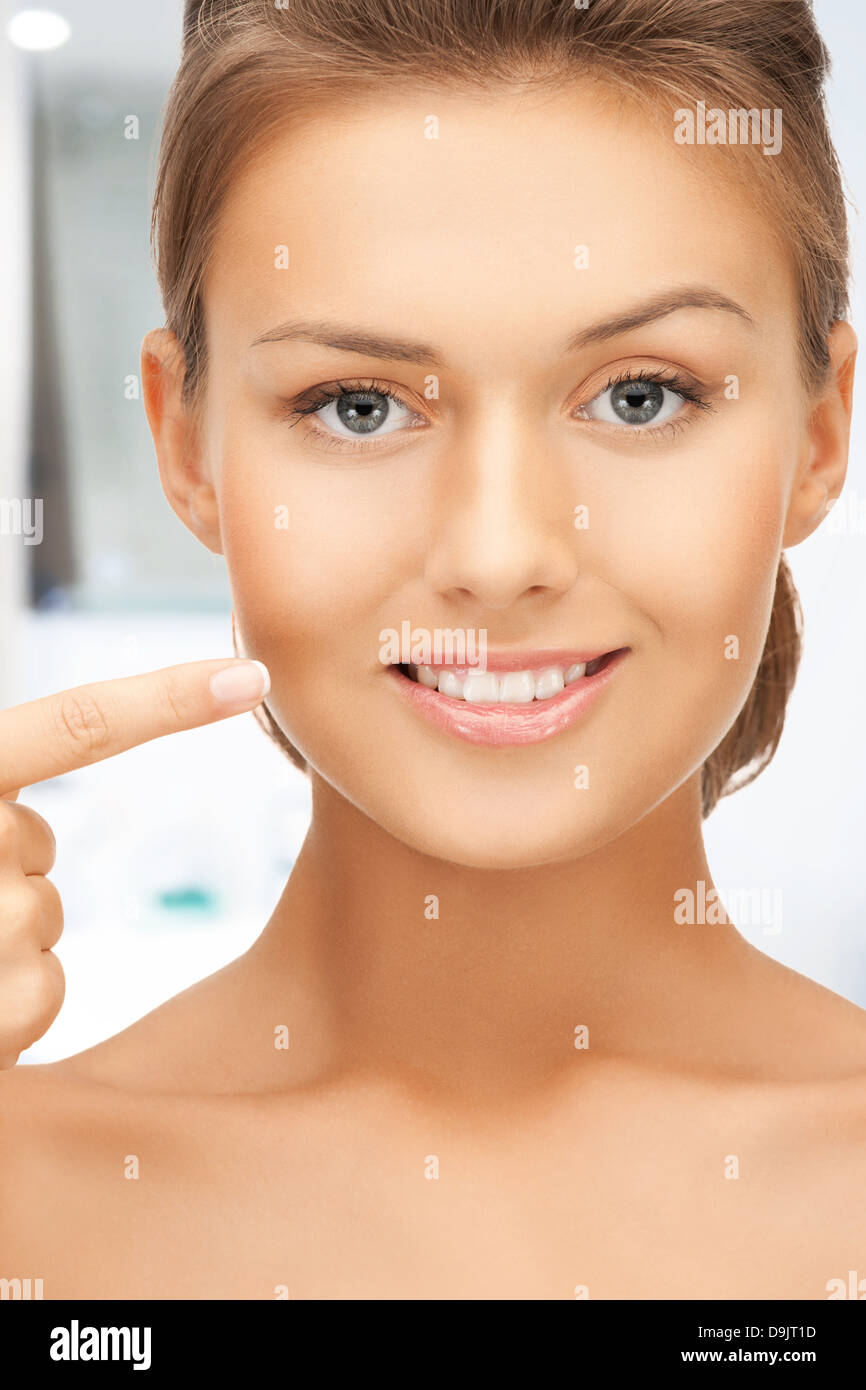 woman showing her teeth Stock Photo - Alamy