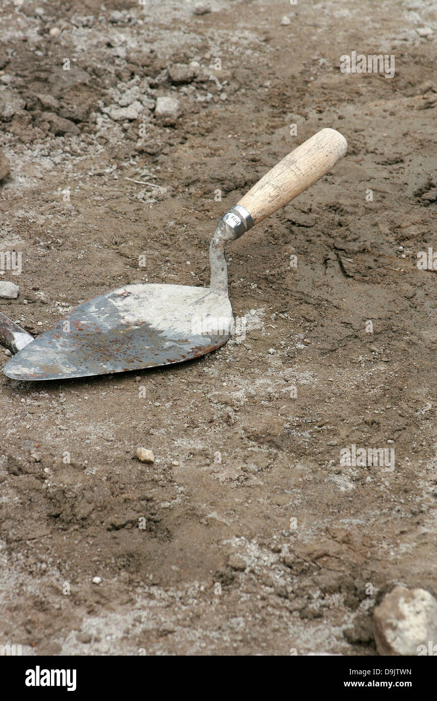 A trowel used for concrete work at a construction site in Cotacachi ...