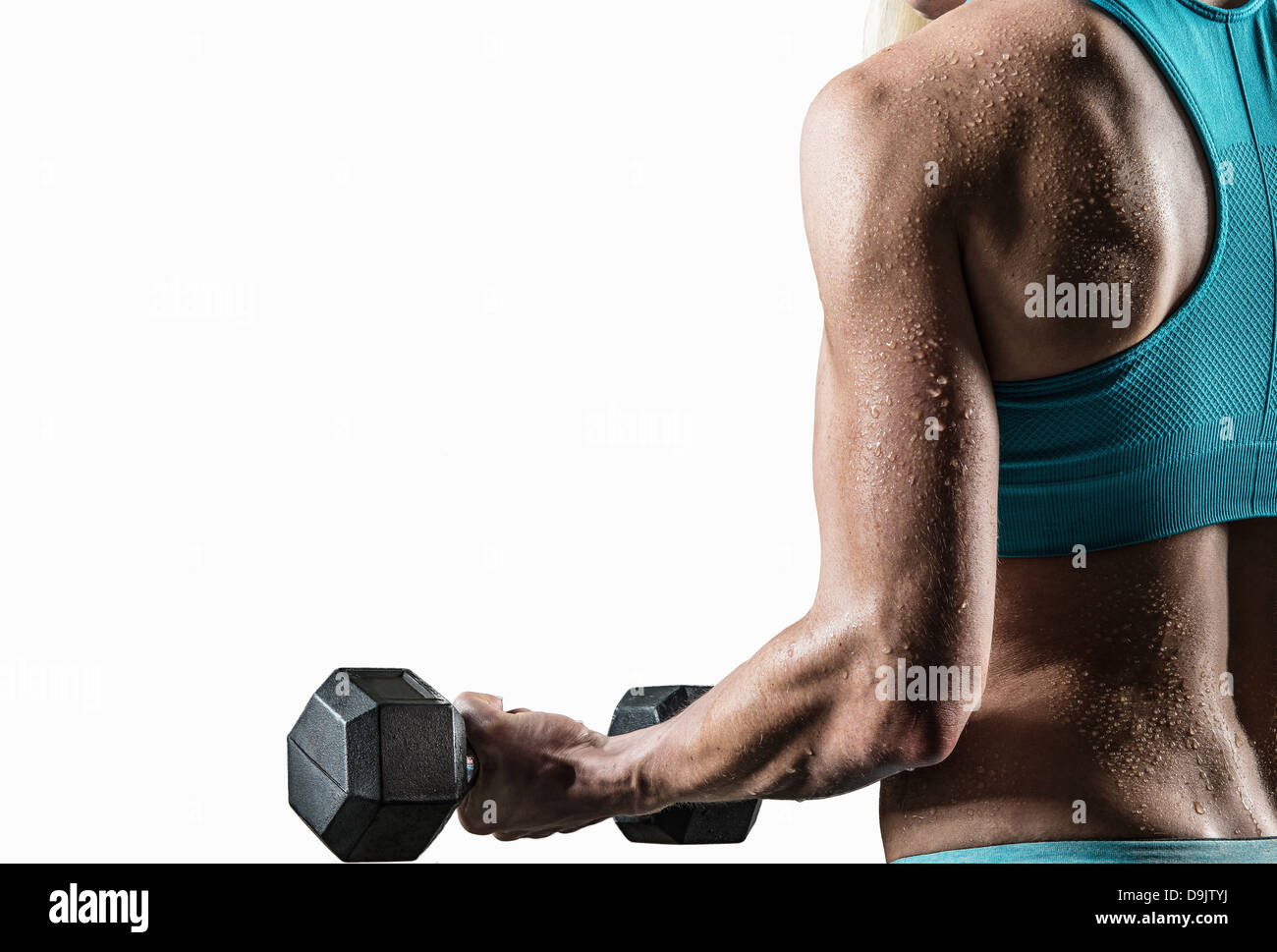 Young woman performing bicep curls, close up Stock Photo - Alamy