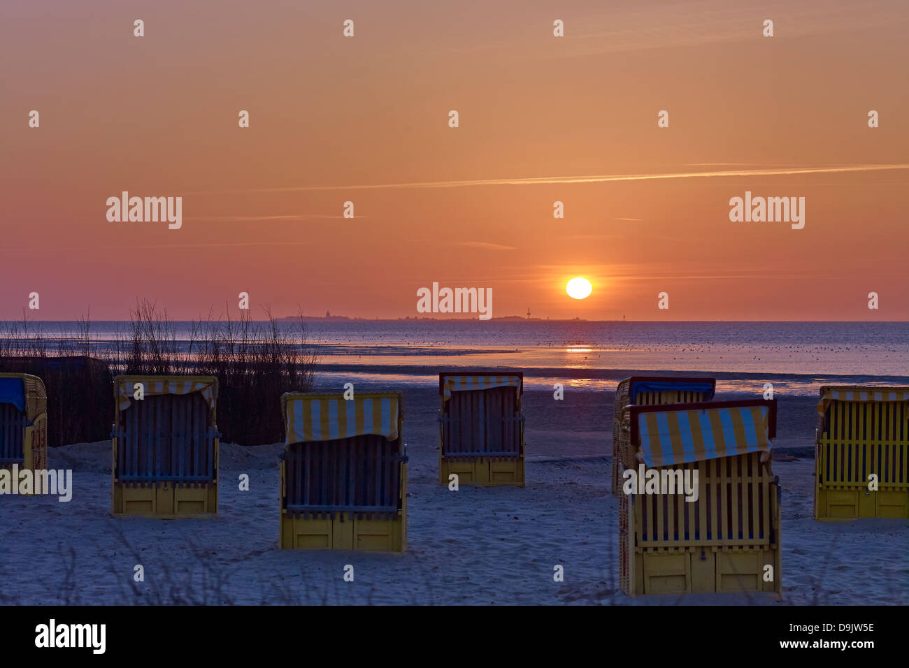Sunset on the beach of duhnen with island neuwerk hi-res stock ...