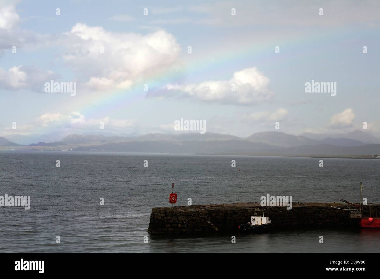 Rainbow viewed across the Inner Sound toward the mountains of ...