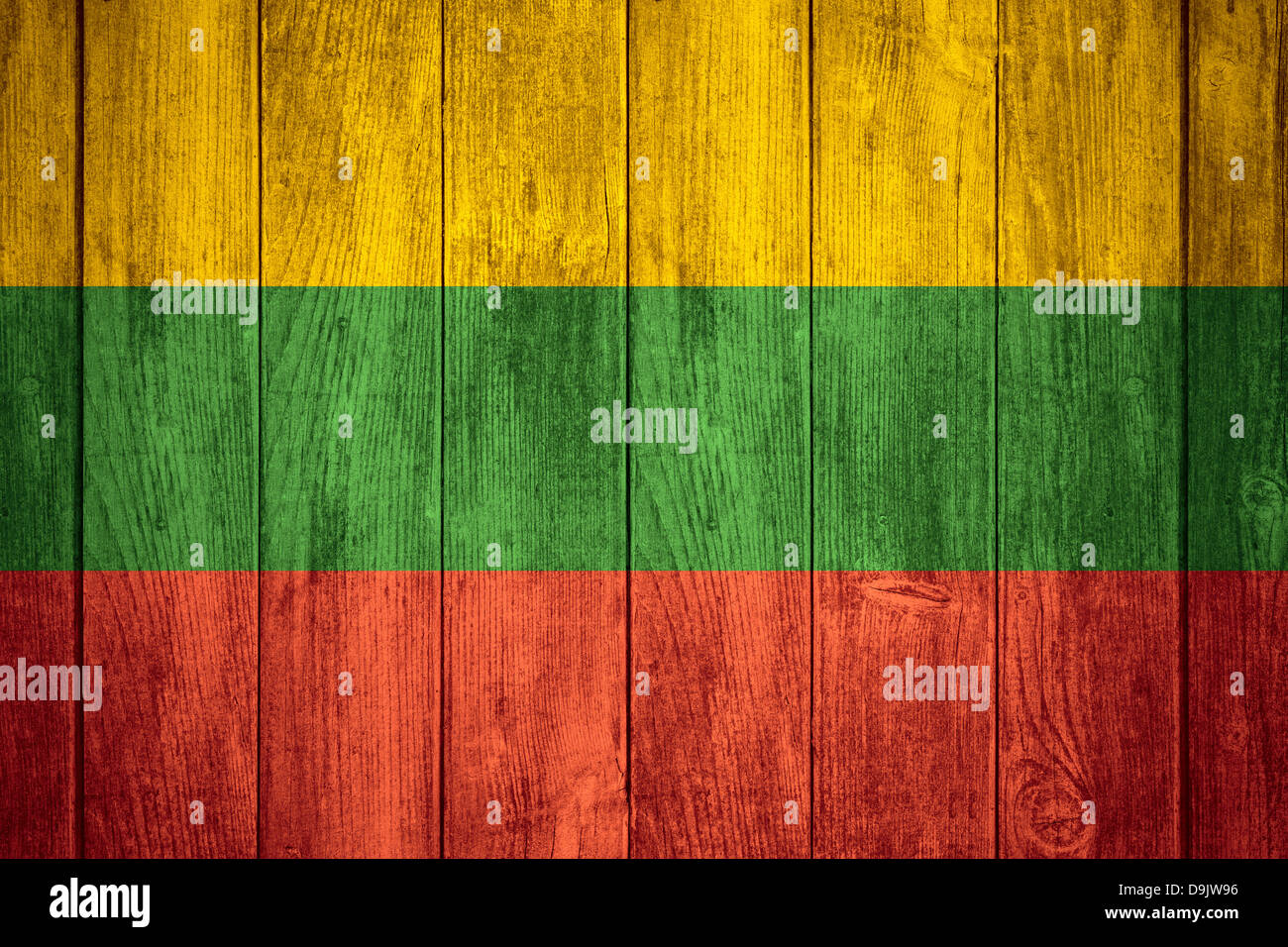 flag of Lithuania or yellow, green and red Lithuanian banner on wooden ...