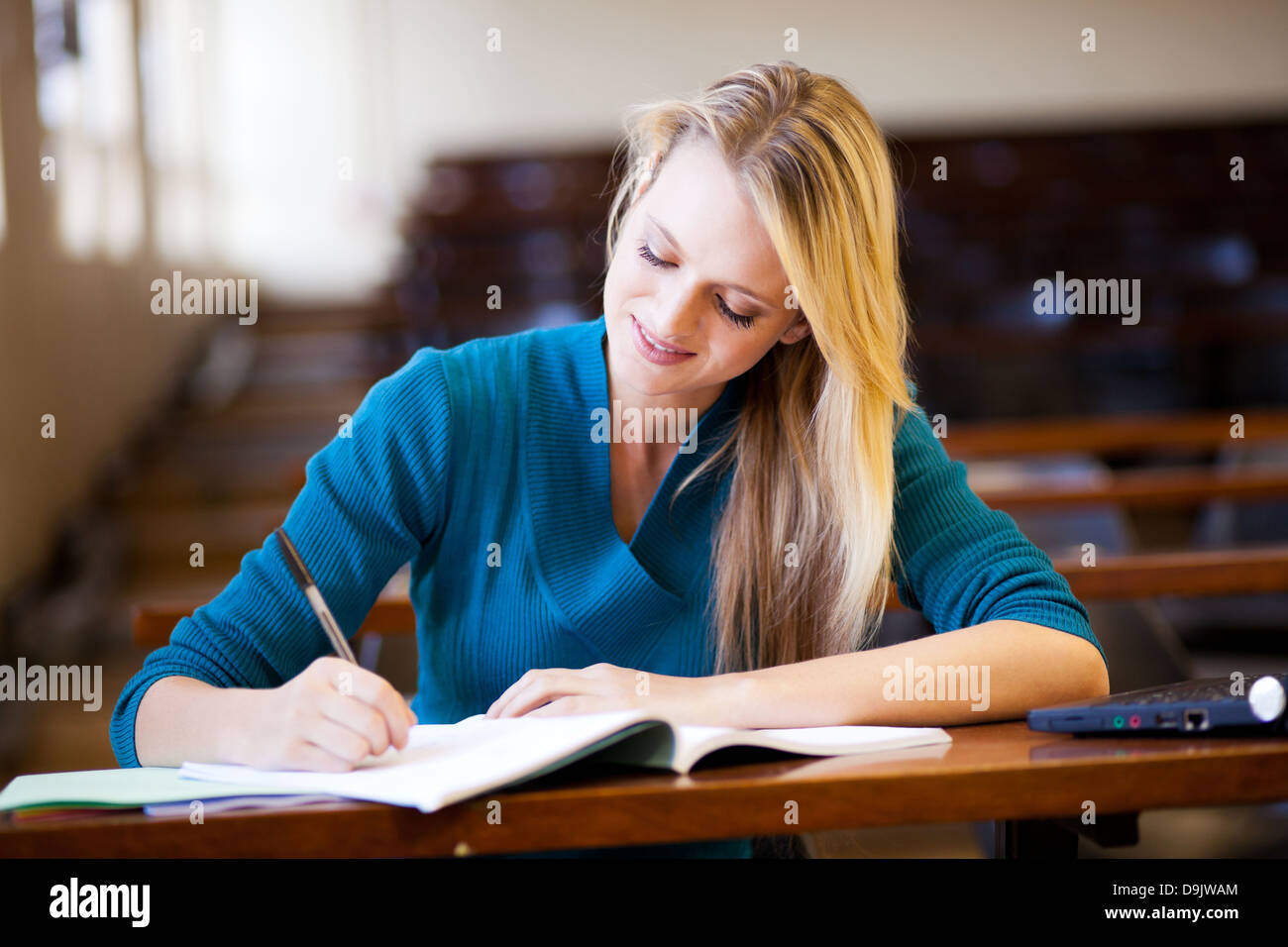 beautiful young female college girl sitting in lecture room Stock Photo ...
