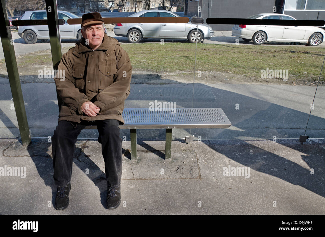 Senior at bus station Stock Photo - Alamy
