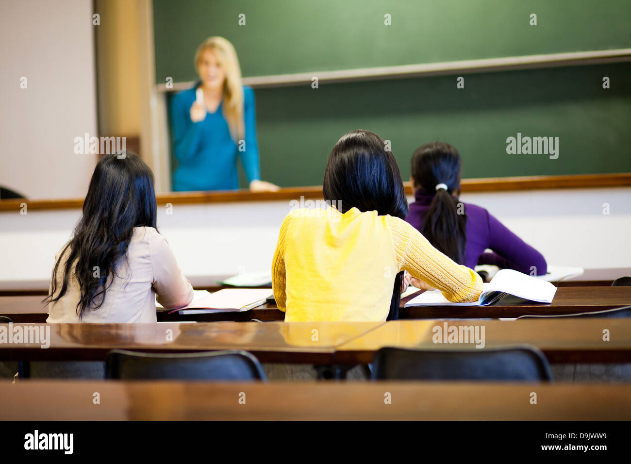group of female college students in classroom with teacher Stock Photo ...