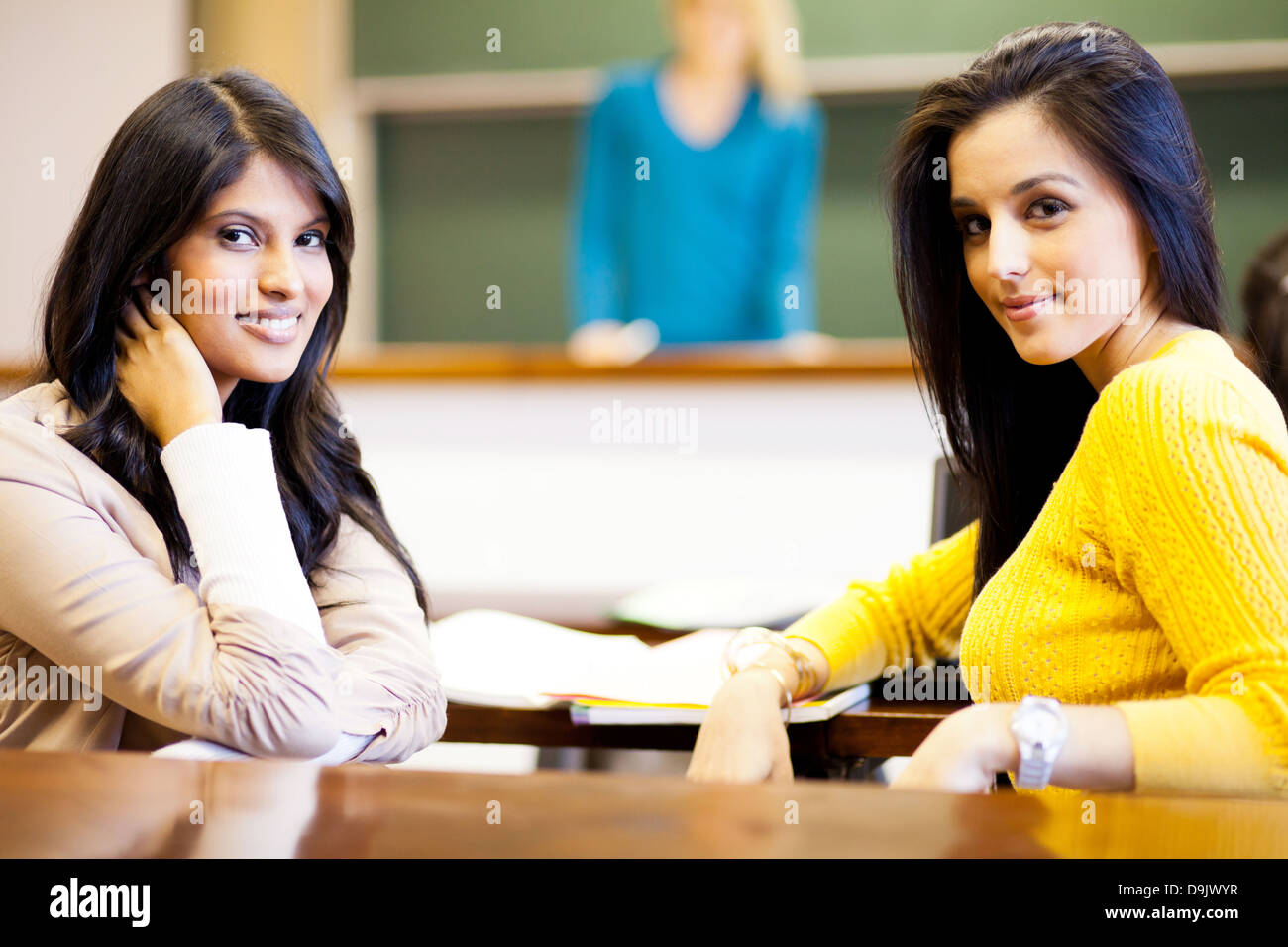 two female college students in classroom Stock Photo - Alamy
