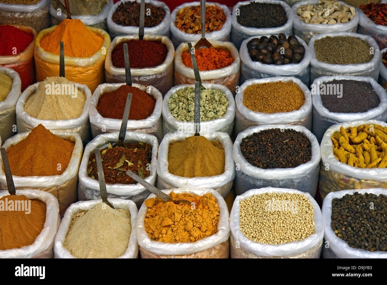 many colorful spice in small bags and spoons Stock Photo - Alamy