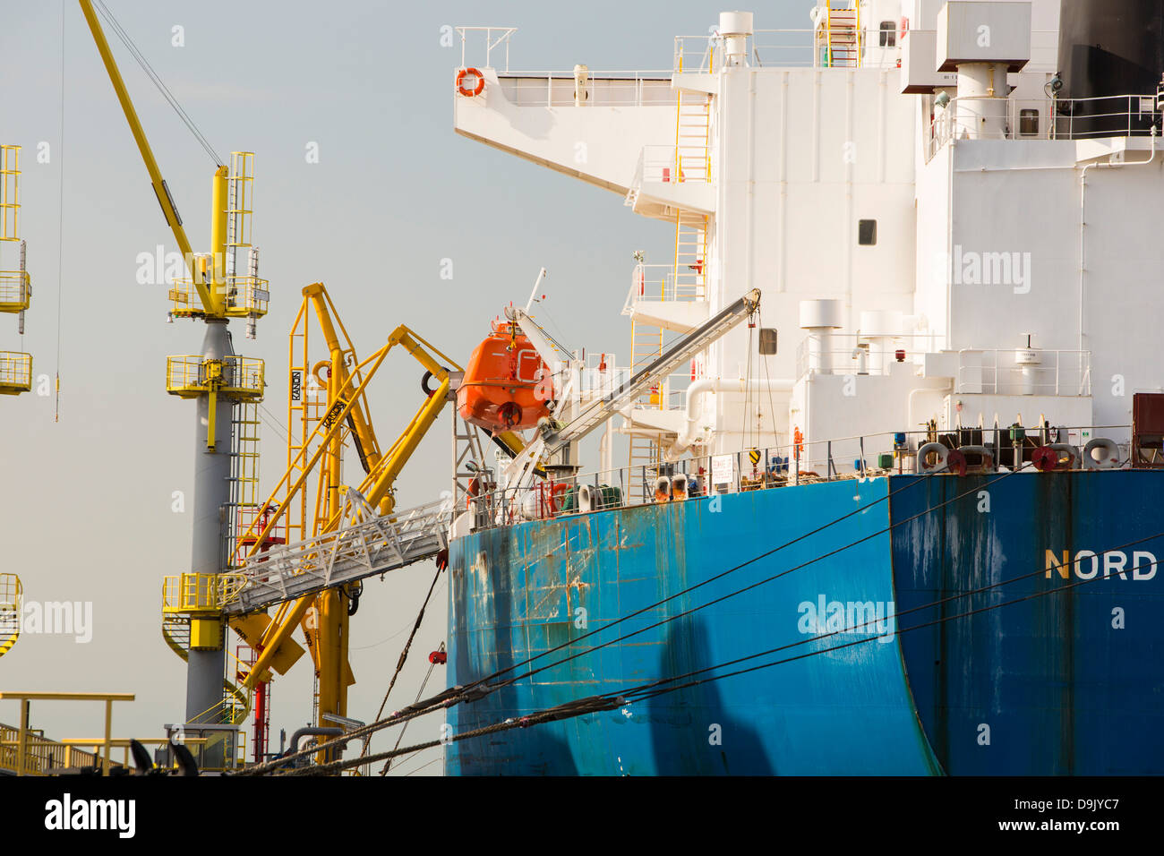 An oil tanker unloading at an oil terminal in Amsterdam, Netherlands ...