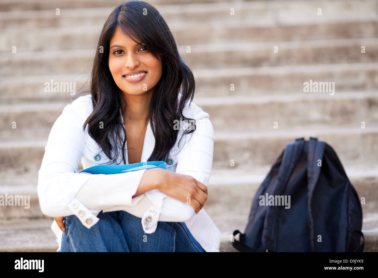 attractive female college student sitting outdoors Stock Photo - Alamy