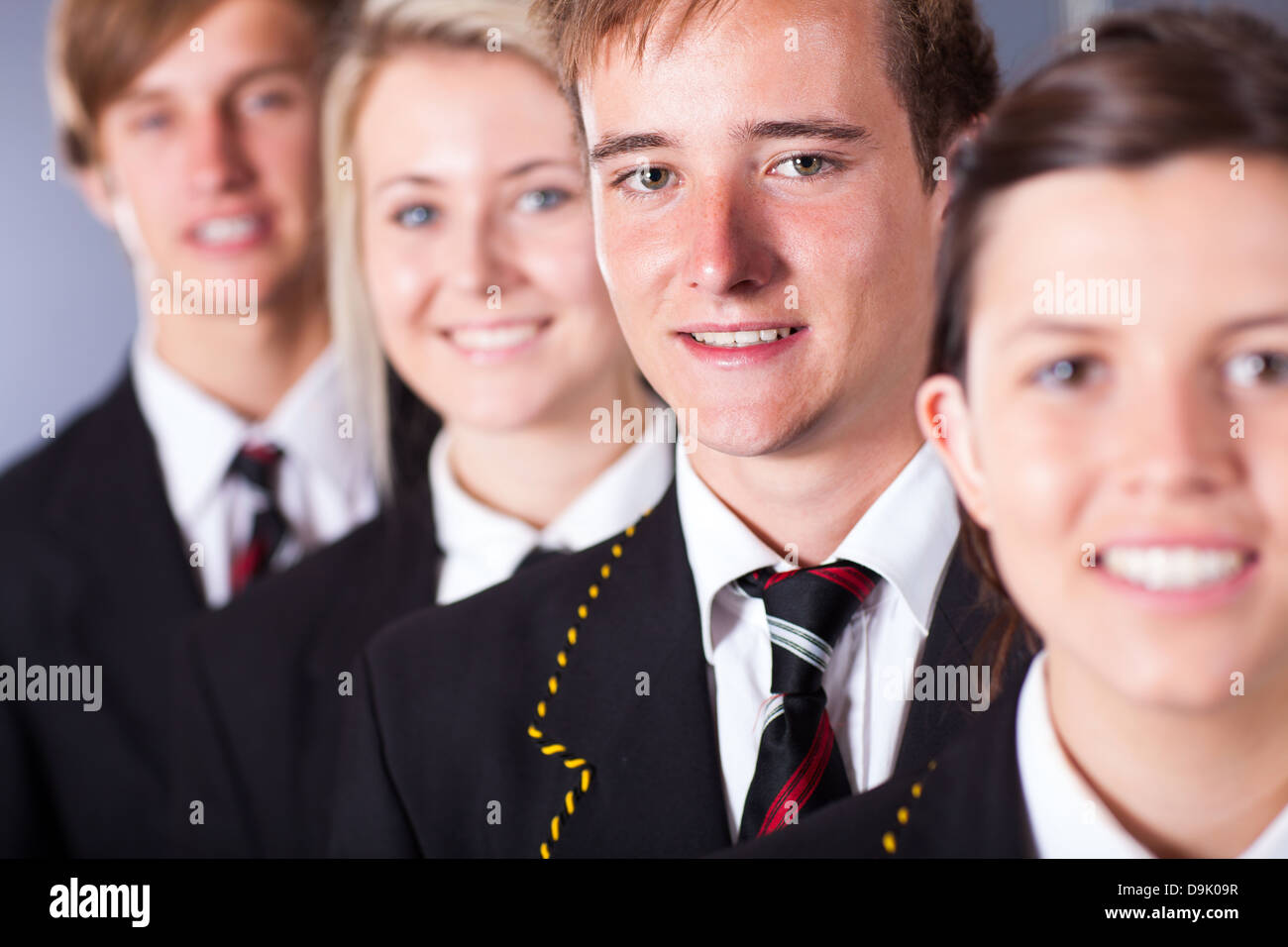 group of high school students in uniforms closeup portrait Stock Photo ...