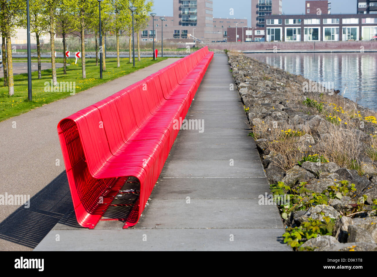 A long red bench in Ijburg, Amsterdam, Netherlands Stock Photo - Alamy