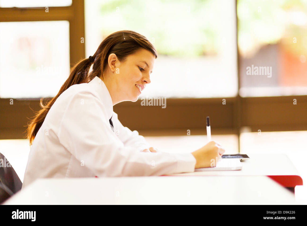 cute high school girl studying in classroom Stock Photo - Alamy