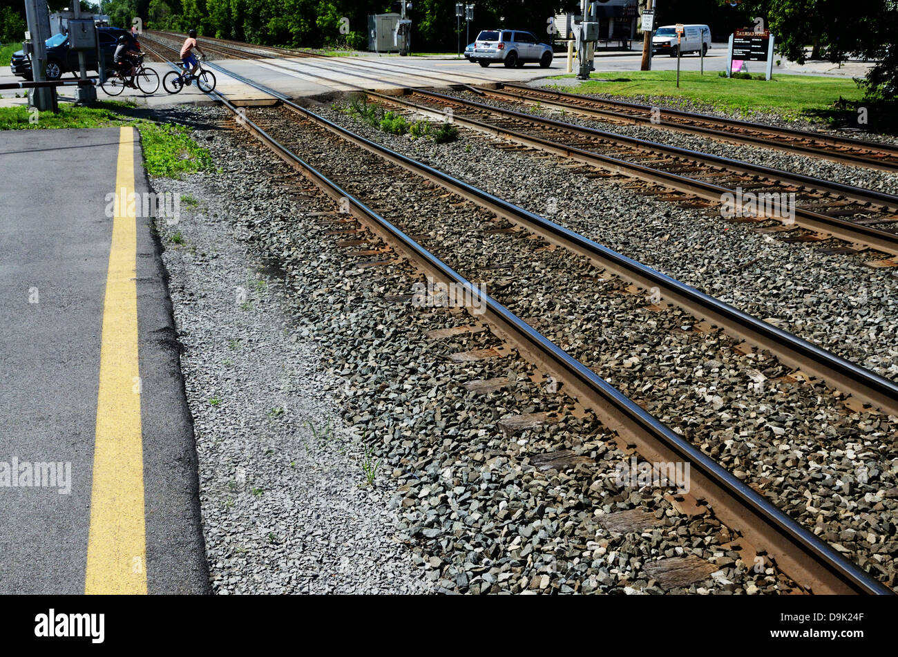 Rail tracks crossed by auto road Stock Photo - Alamy