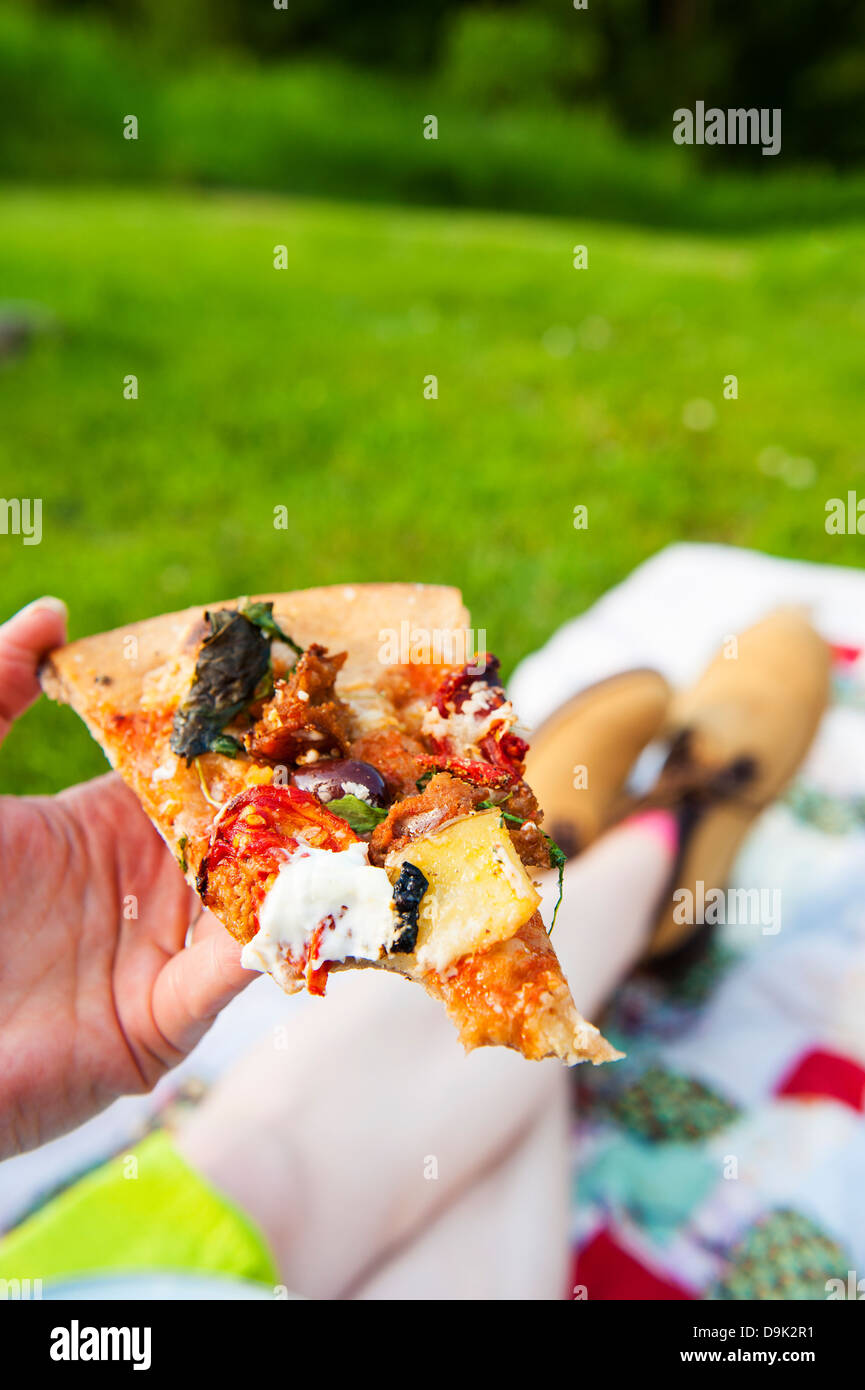 Hand holding pizza hi-res stock photography and images - Alamy