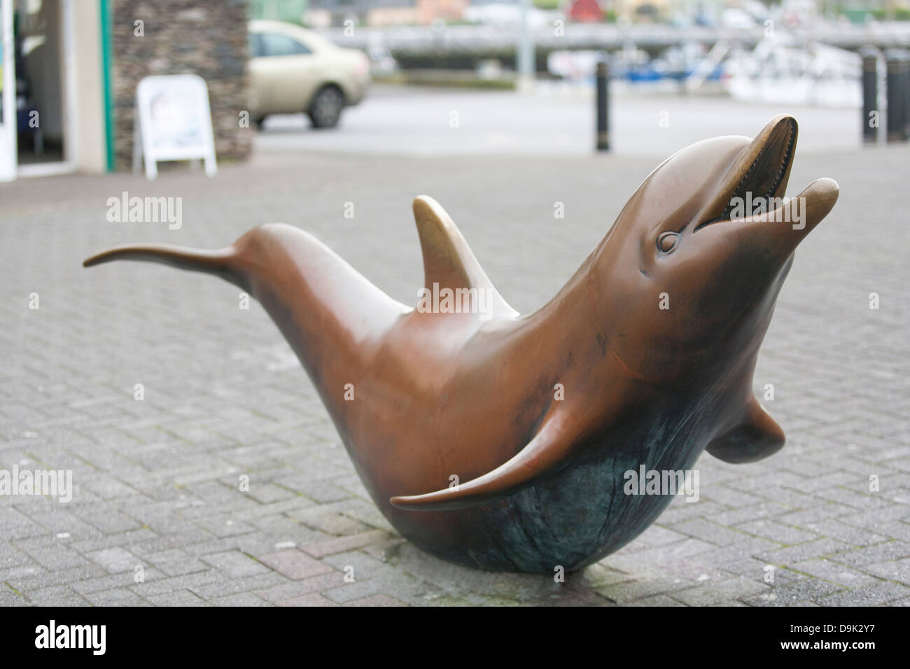The bronze statue of Fungie the Dolphin on the Harbor in Dingle, County ...