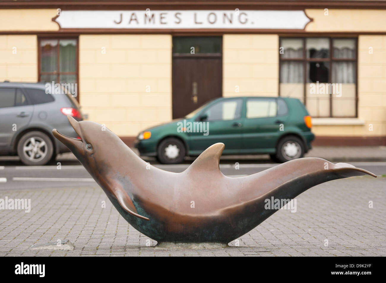 The bronze statue of Fungie the Dolphin on the Harbor in Dingle, County ...