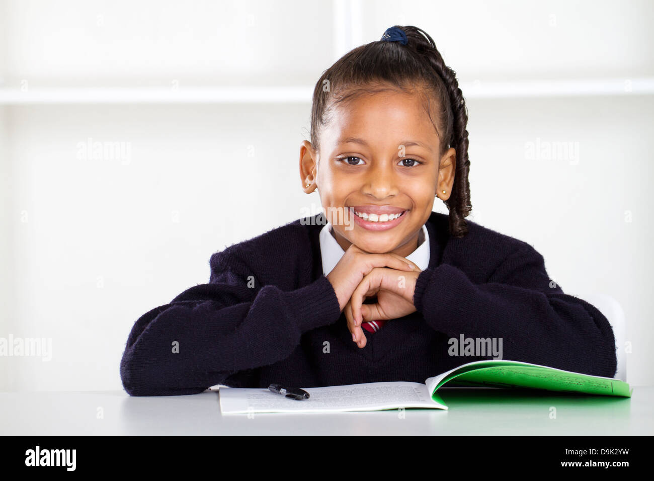 cute primary schoolgirl in classroom Stock Photo - Alamy