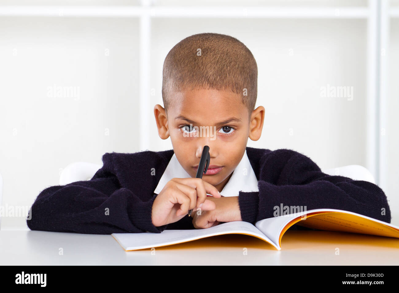 African boy thinking uniform hi-res stock photography and images - Alamy