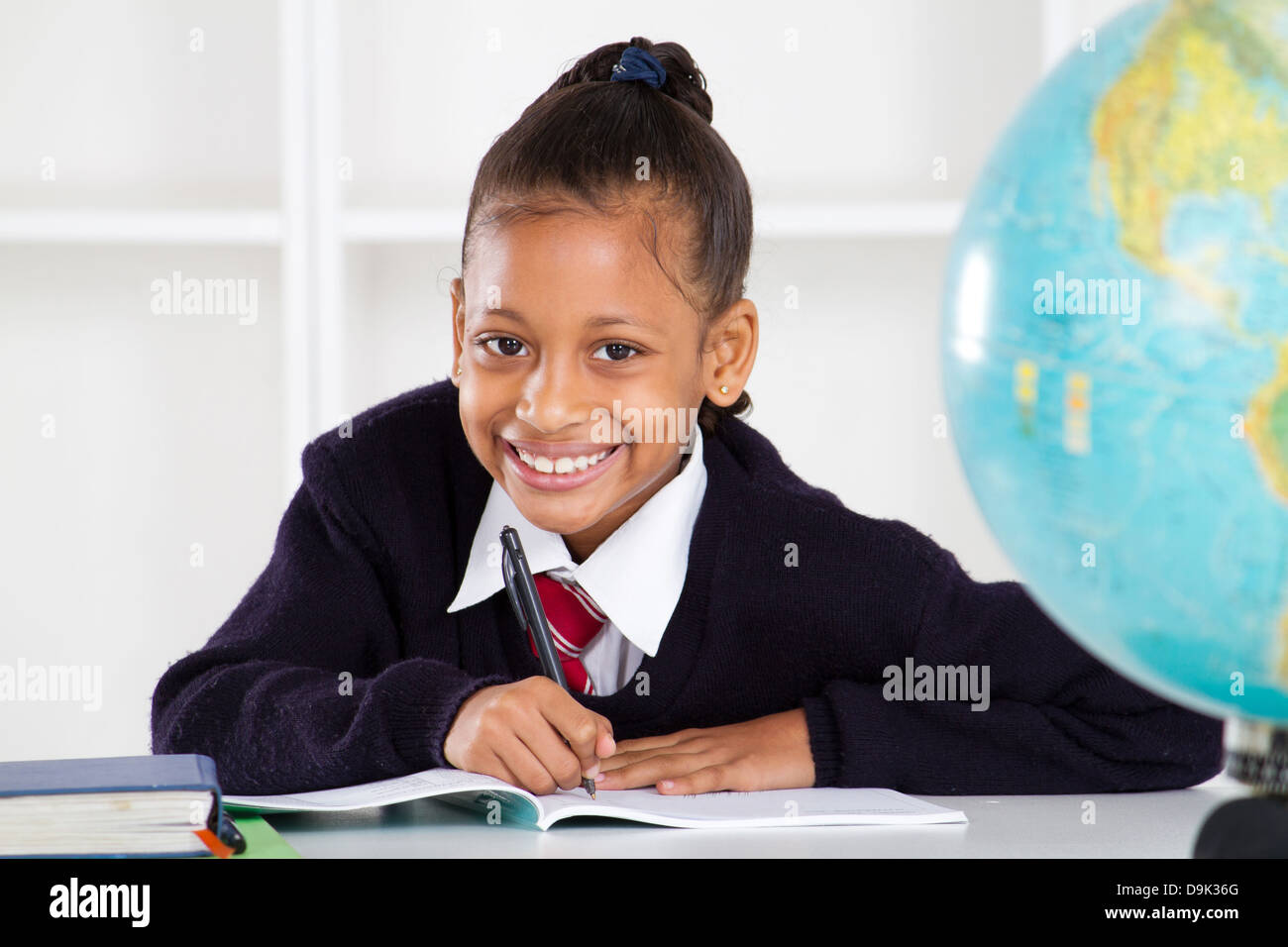 happy elementary school girl in classroom Stock Photo - Alamy