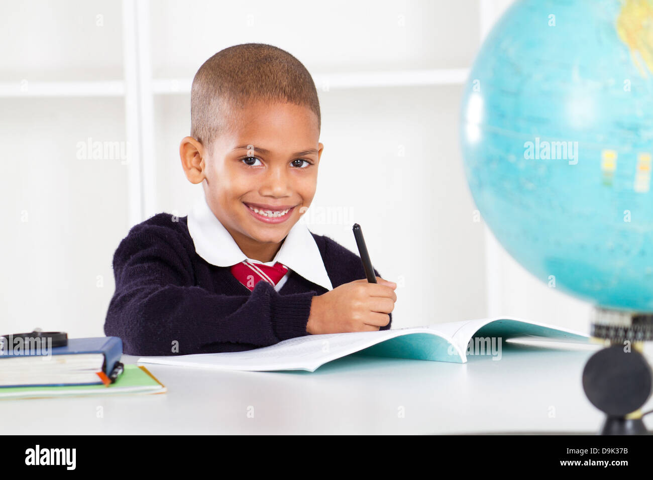 happy primary school boy in classroom Stock Photo - Alamy