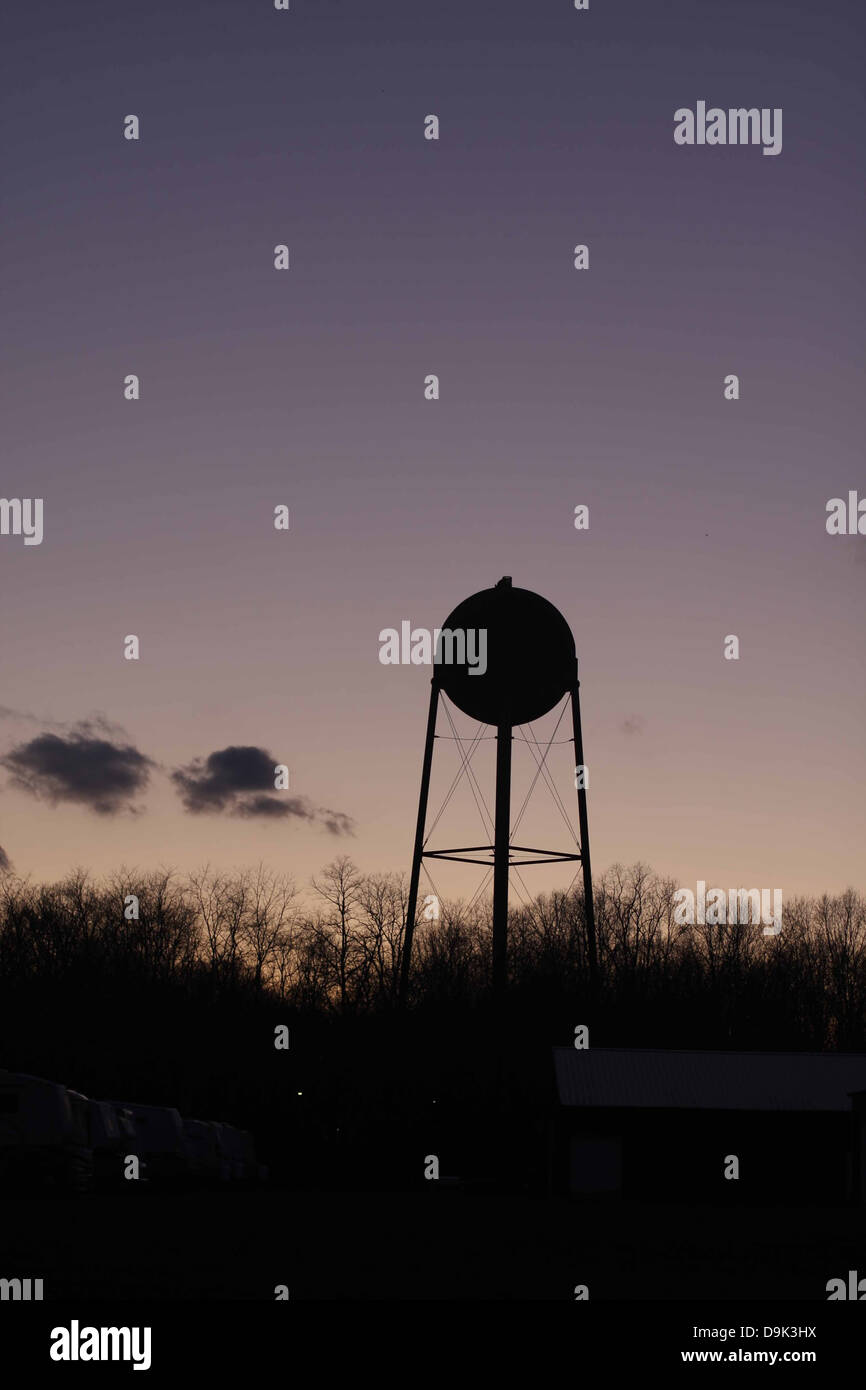 water tower watertower silhouette sunset sunrise clouds trees vertical ...