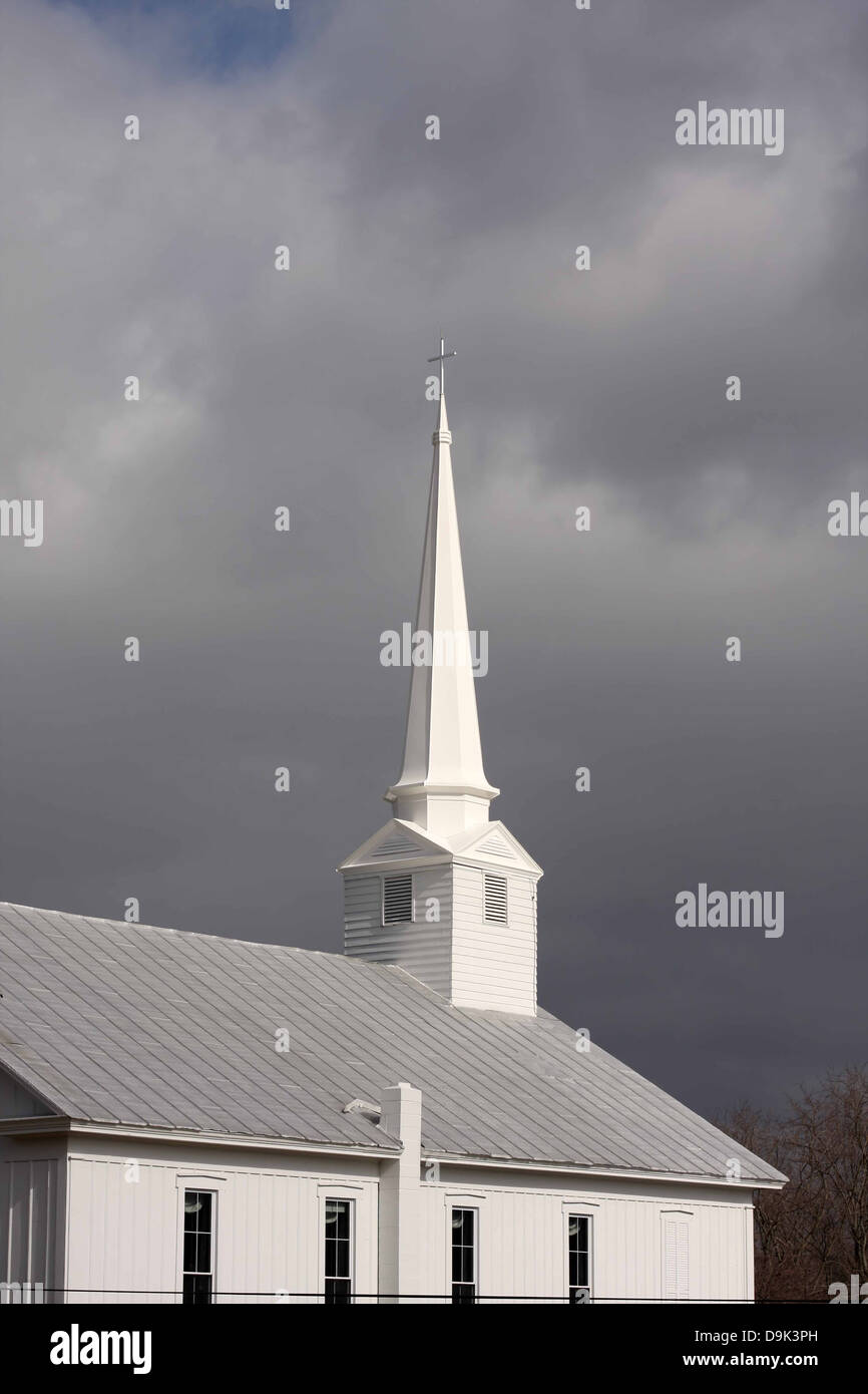church building Christian Catholic white steeple cross clouds storm sky ...