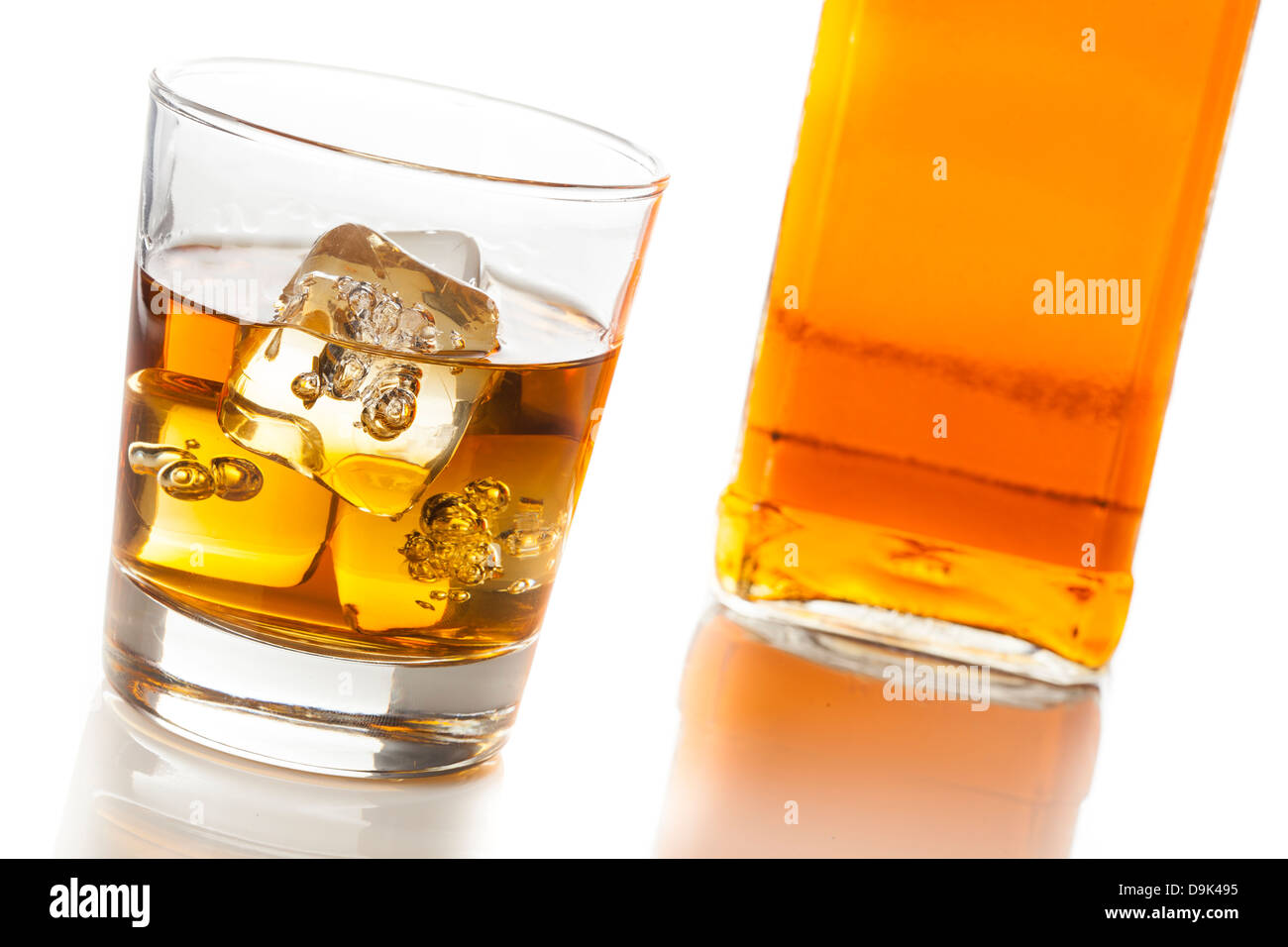 Golden Brown Whisky on the rocks in a glass Stock Photo - Alamy